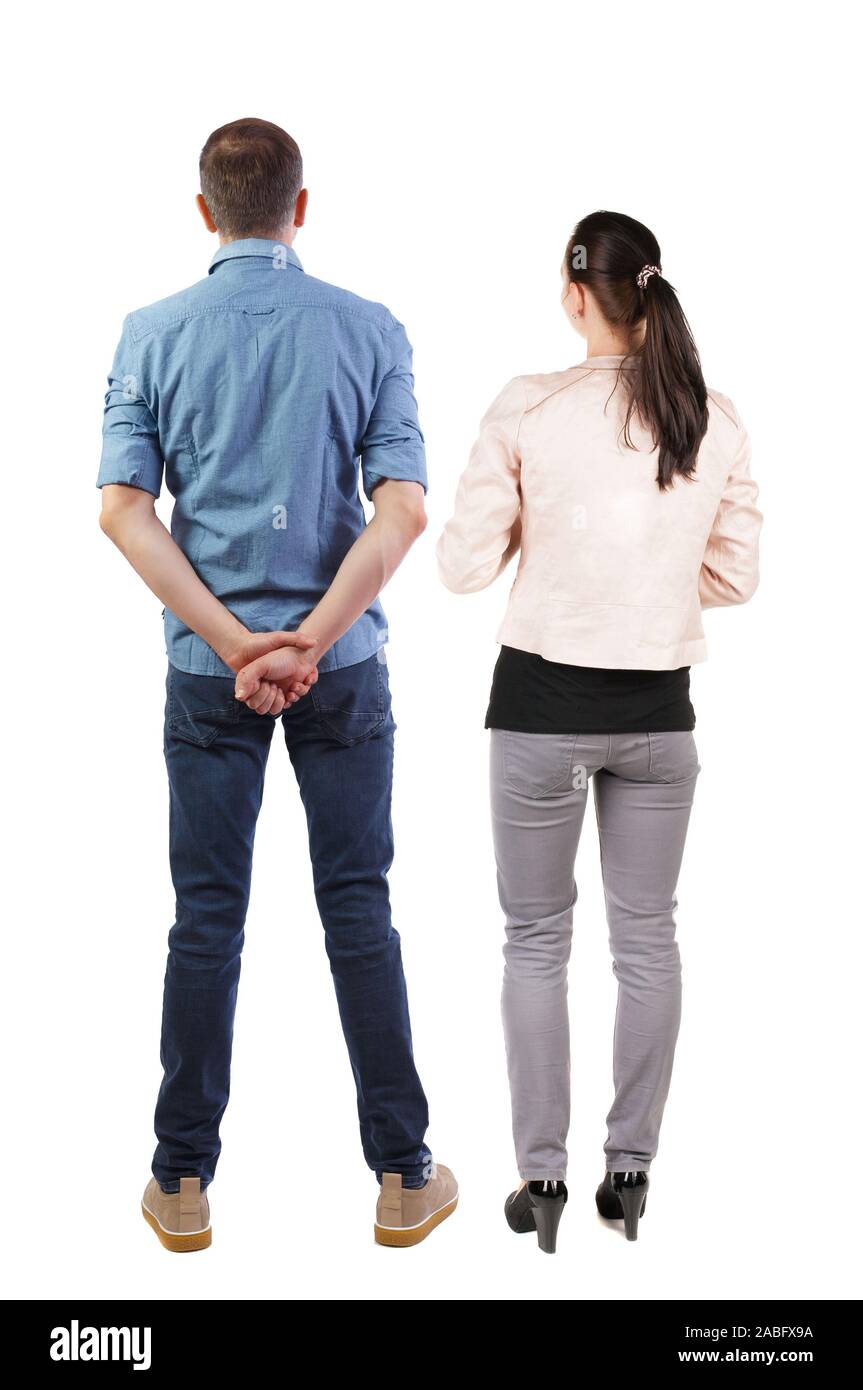 Back view of couple. beautiful friendly girl and guy together. Rear ...