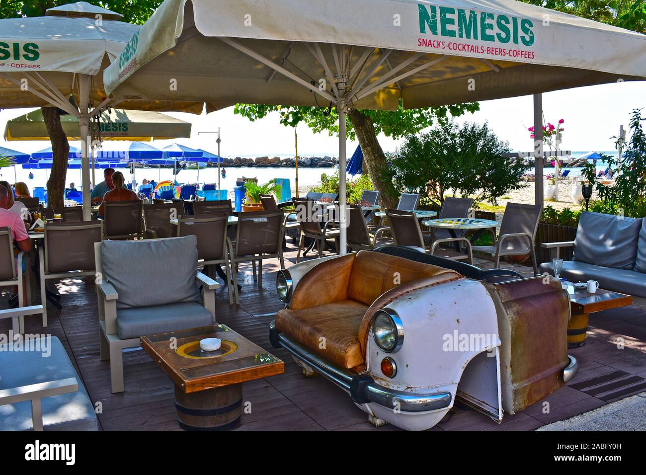Street view of outdoor restaurant /café overlooking the sea in the ...