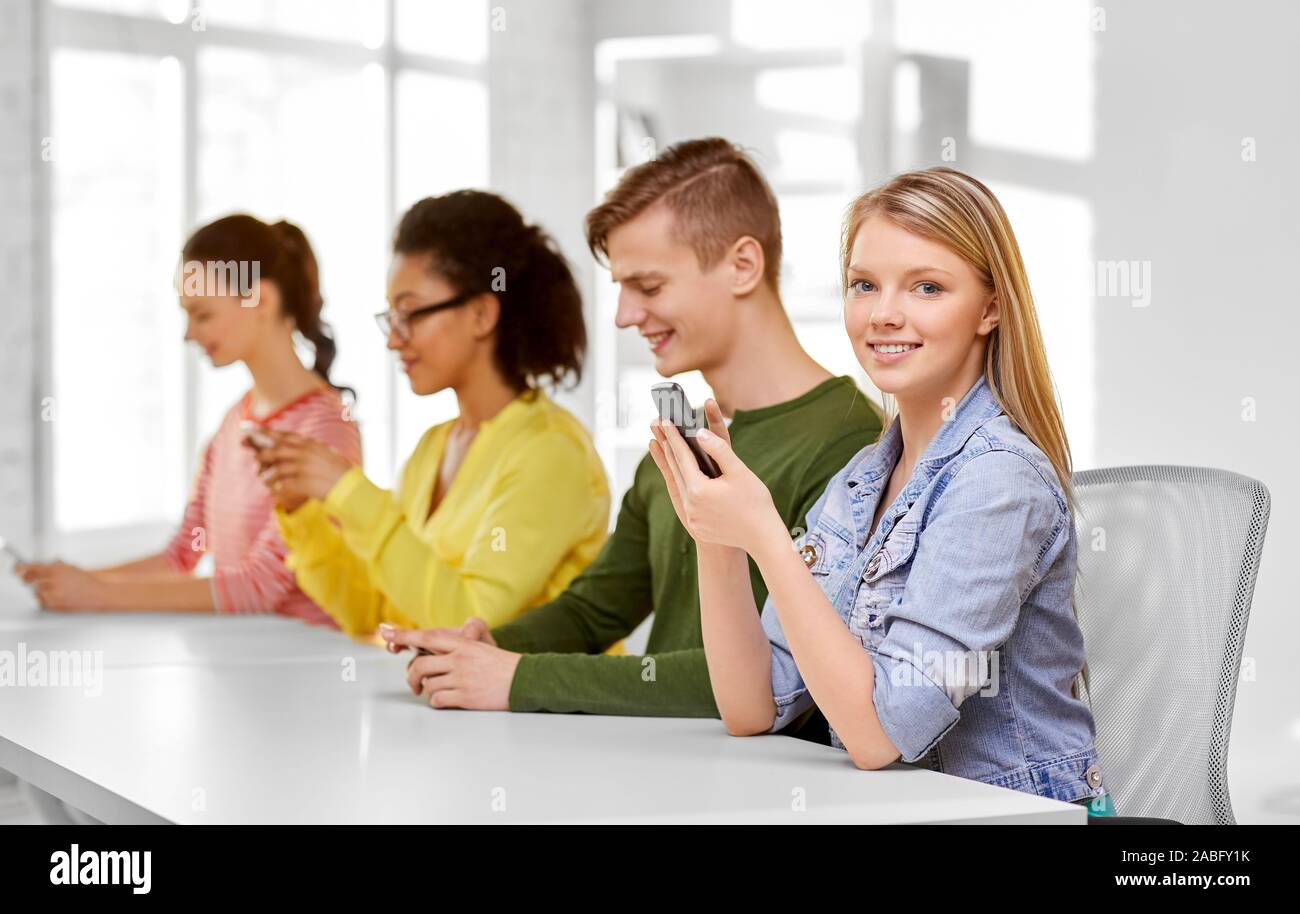 happy high school students with smartphones Stock Photo - Alamy