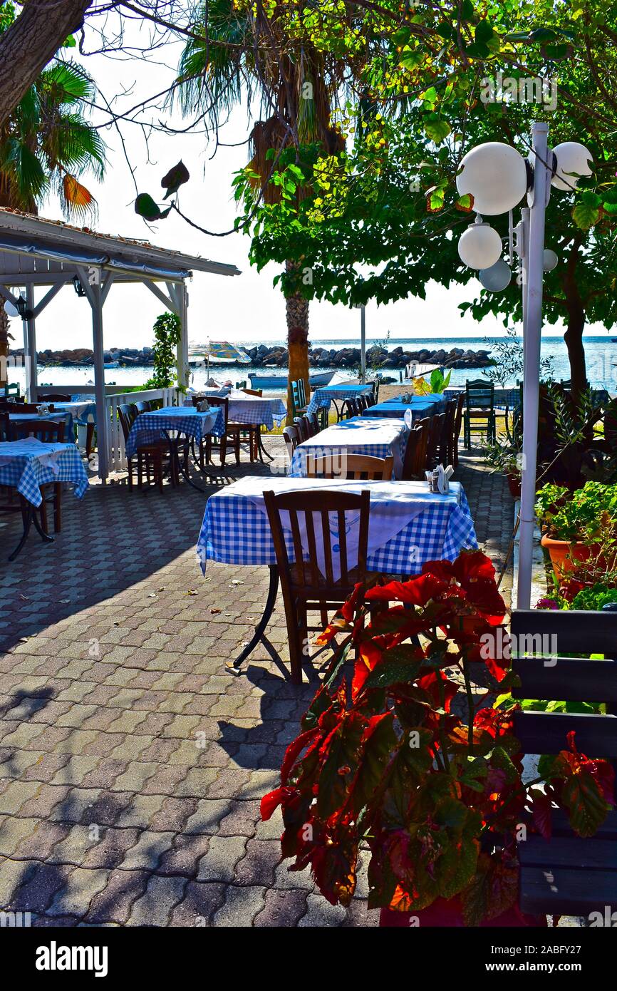 Street view of outdoor restaurant /café overlooking the sea in the ...