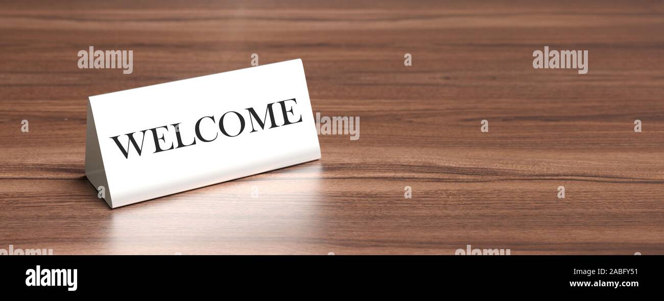 Welcome sign. Table tent, Welcome text on a wooden table, banner, copy ...