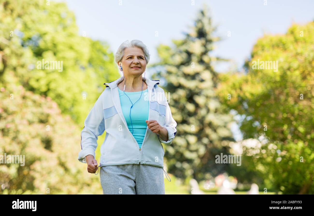Elderly people running in the park hi-res stock photography and images ...