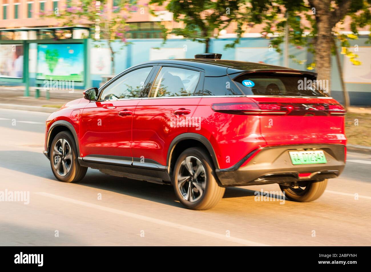 An Xpeng G3, from a Chinese EV startup, driving by in Guangzhou Stock ...