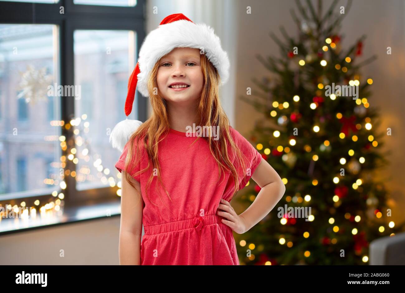 Pretty redhead in santa hat hi-res stock photography and images - Alamy