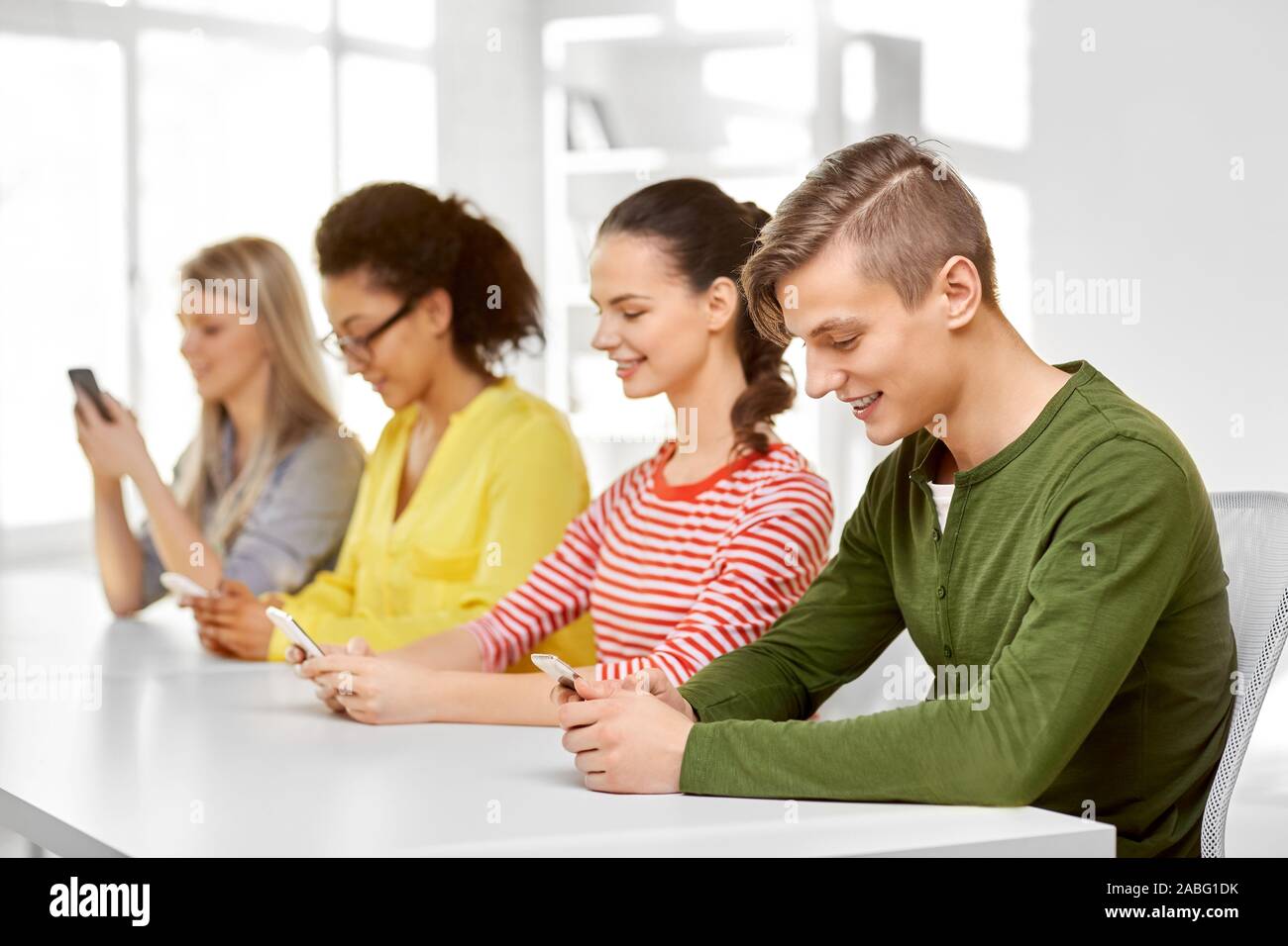 happy high school students with smartphones Stock Photo - Alamy