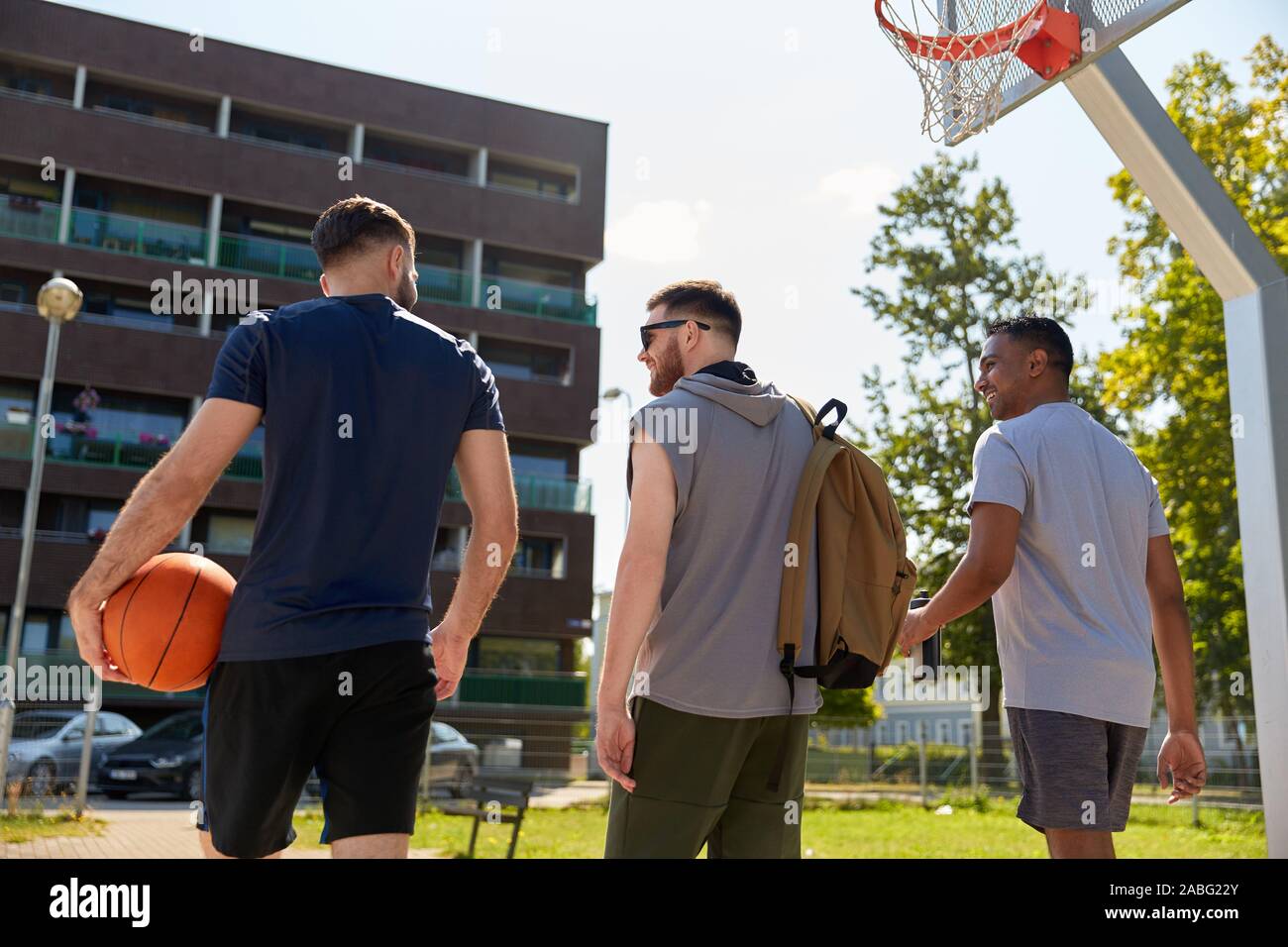 group of male friends going to play basketball Stock Photo - Alamy
