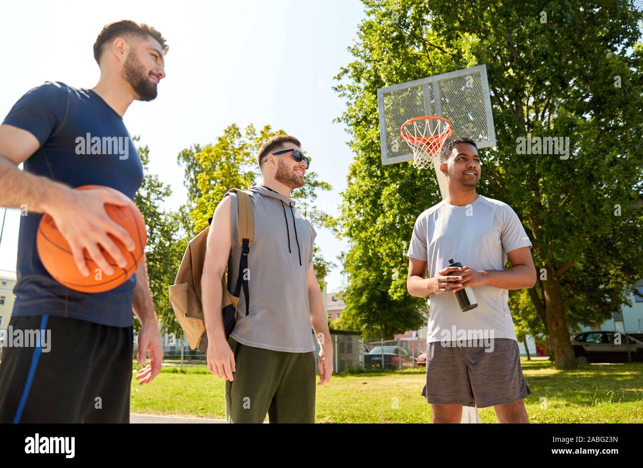 group of male friends going to play basketball Stock Photo - Alamy