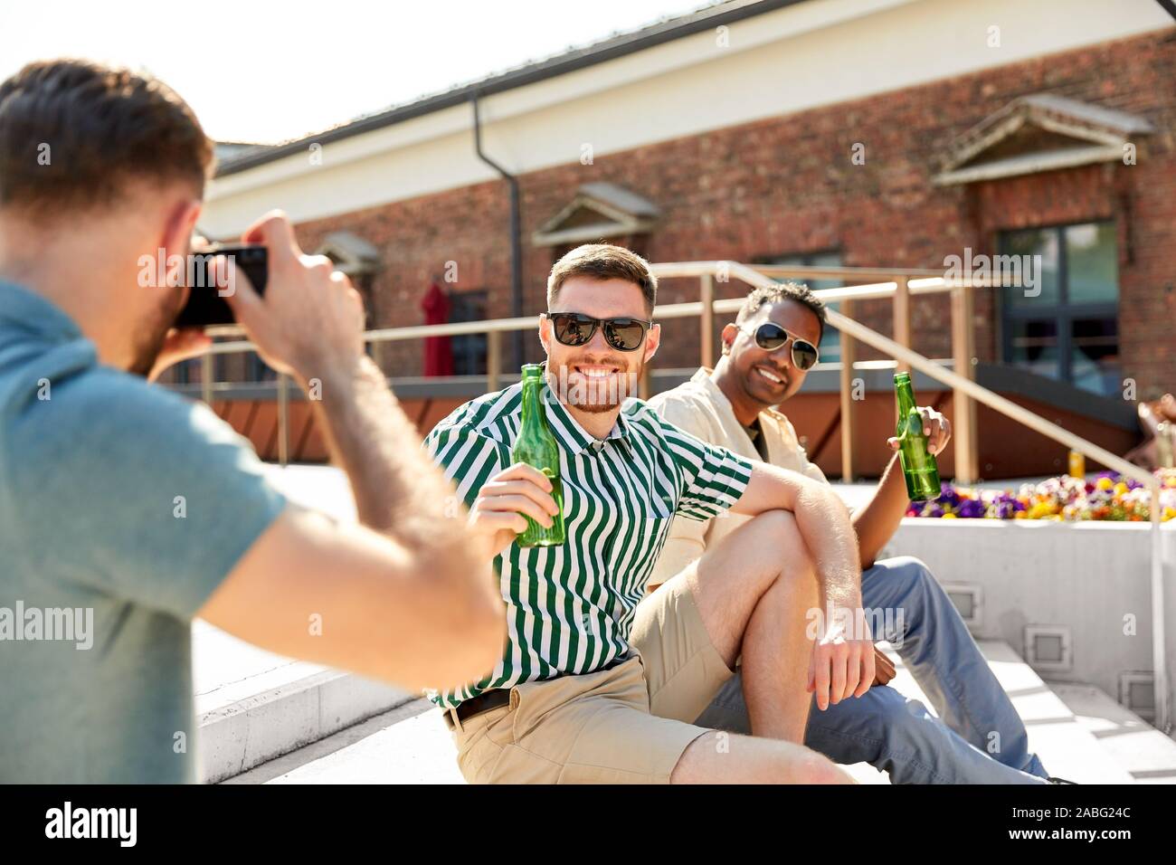 Drinking beer sitting on street hi-res stock photography and images - Alamy