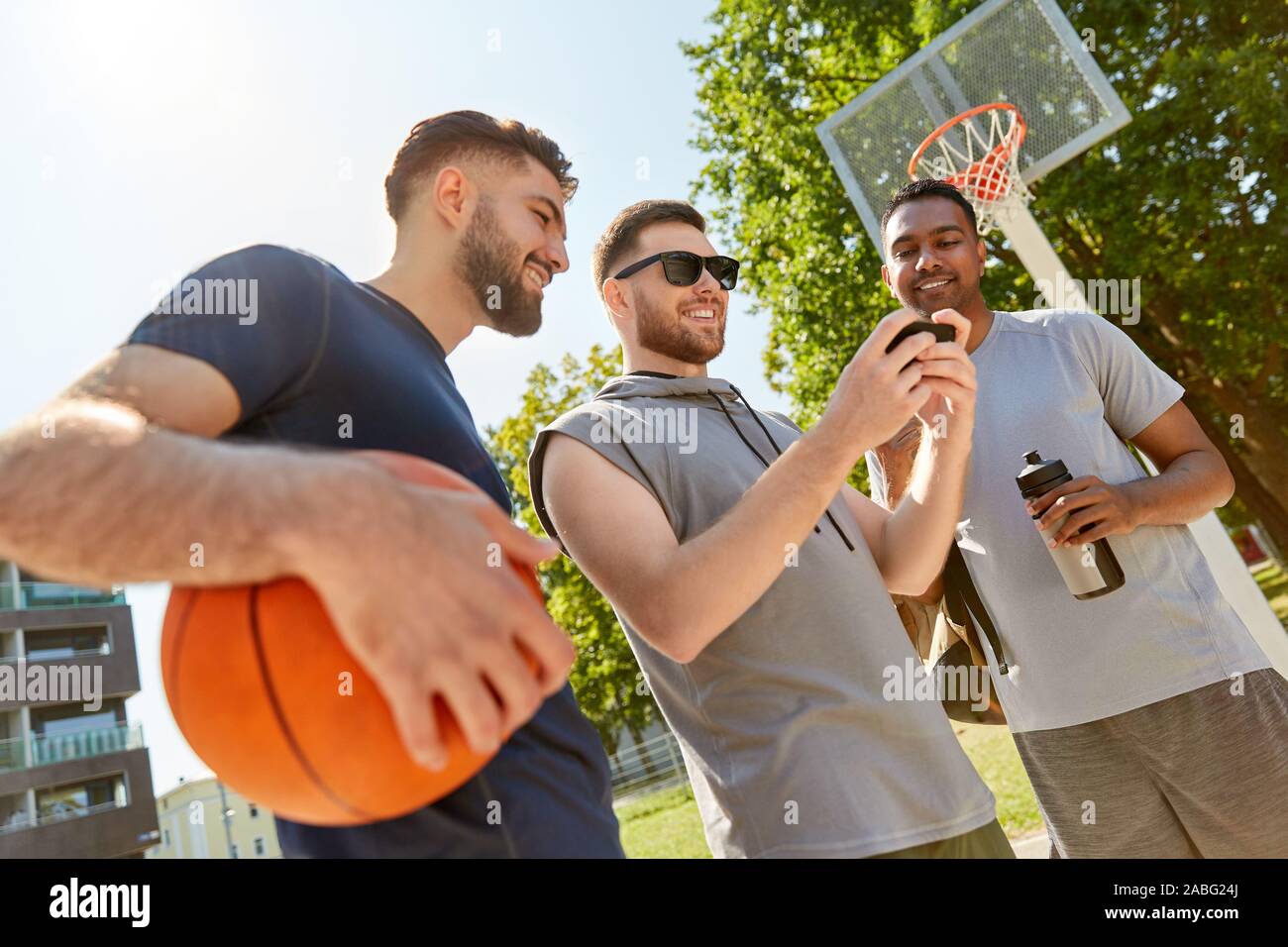 Young man on basketball playground hi-res stock photography and images ...