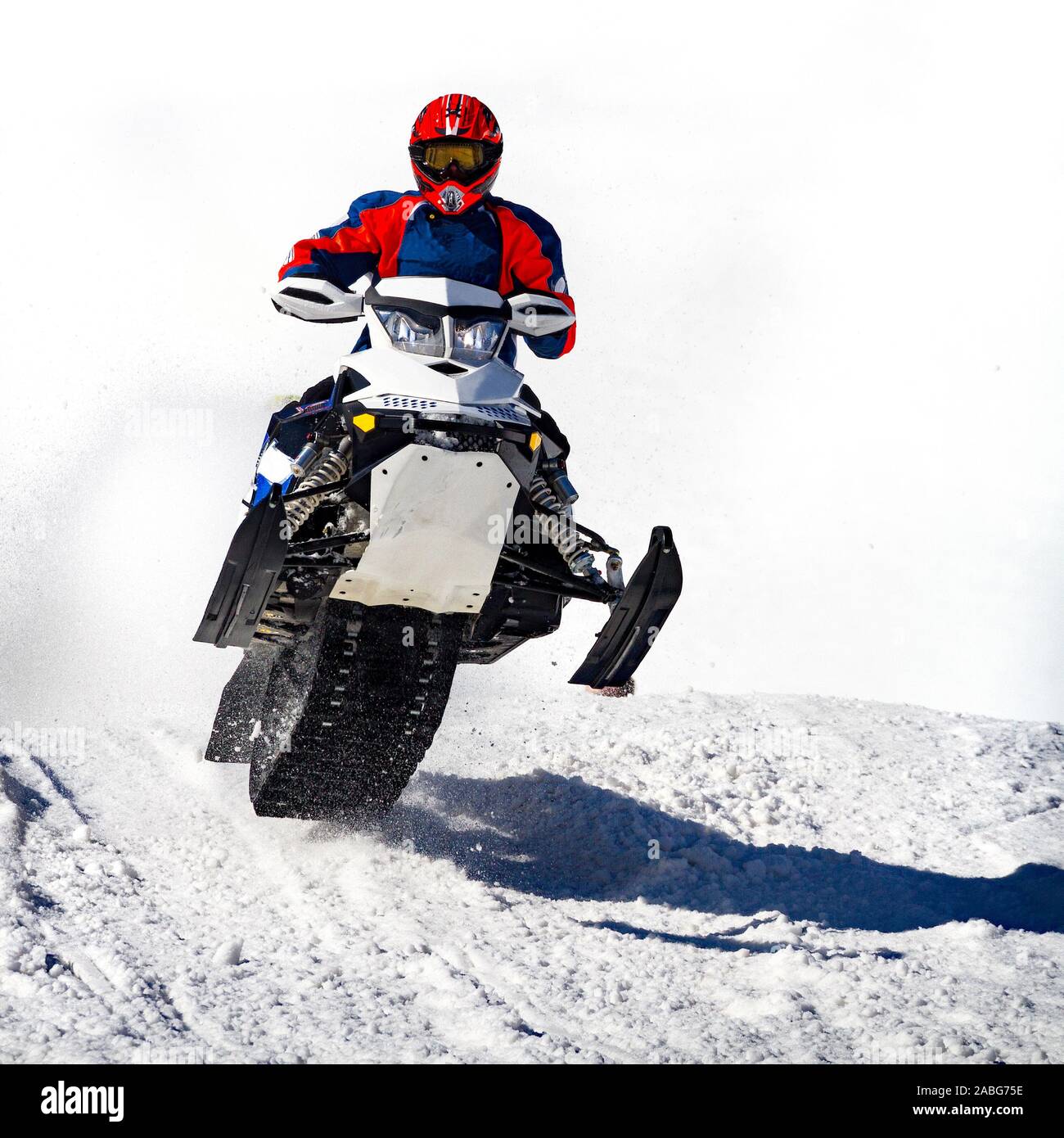 soaring in the snowmobile race Stock Photo - Alamy