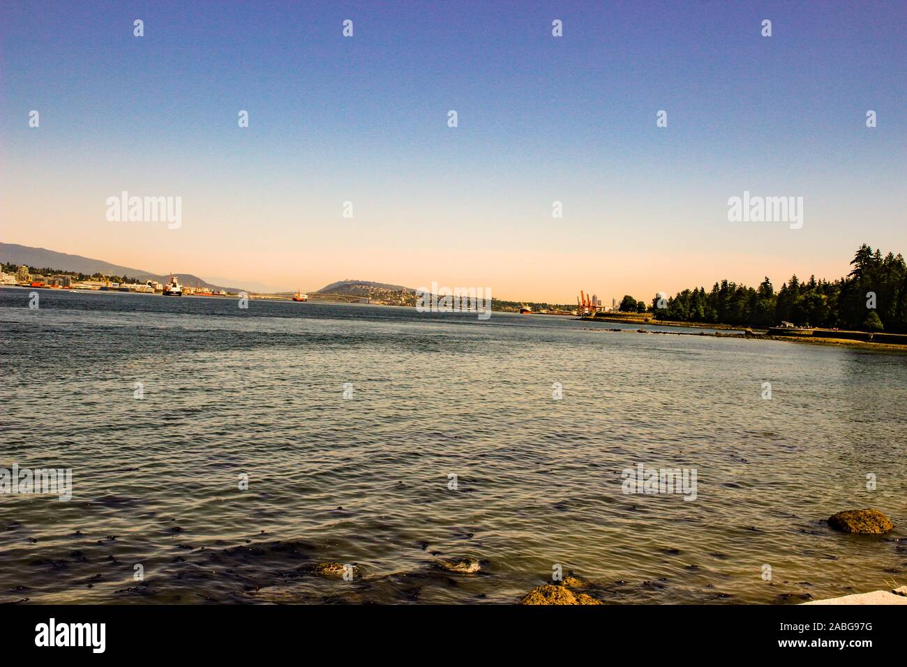 Siwash Rock in Stanley Park at sunrise in Vancouver Stock Photo - Alamy