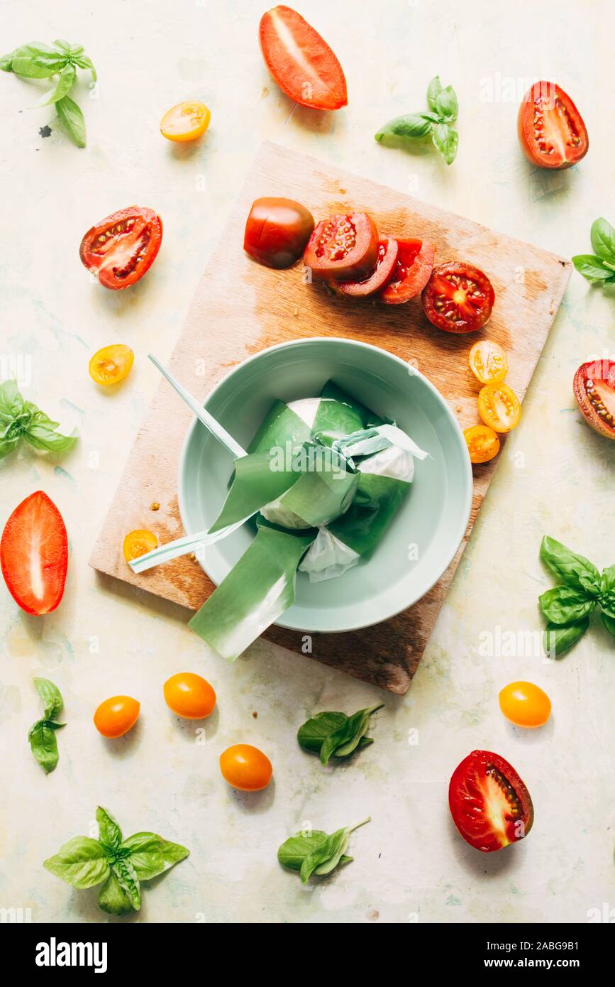 Burrata cheese made with "mozzarella di bufala" on a cozy package, with ...