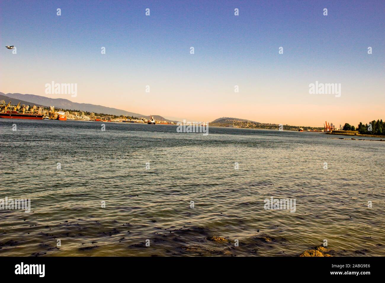 Siwash Rock in Stanley Park at sunrise in Vancouver Stock Photo - Alamy
