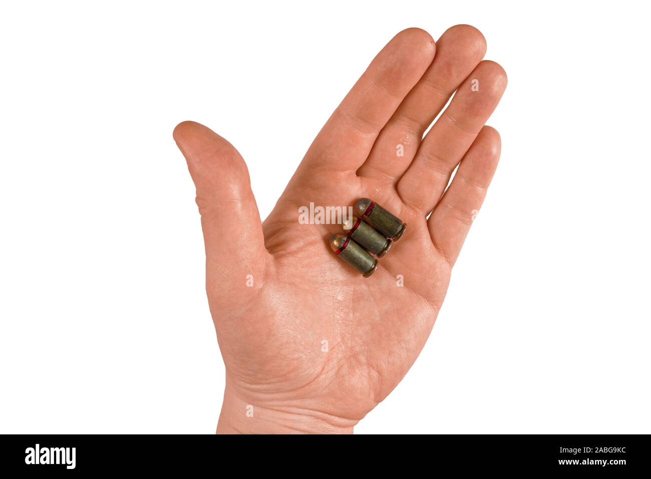 Man hand holds three bullets on an open palm. Isolated closeup on white ...