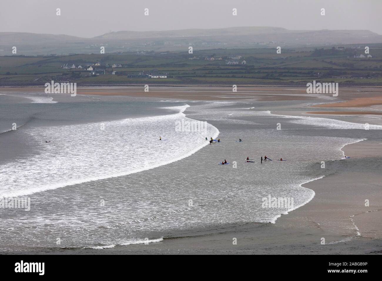 Surf school in the water on sandy beach, Ireland Stock Photo - Alamy
