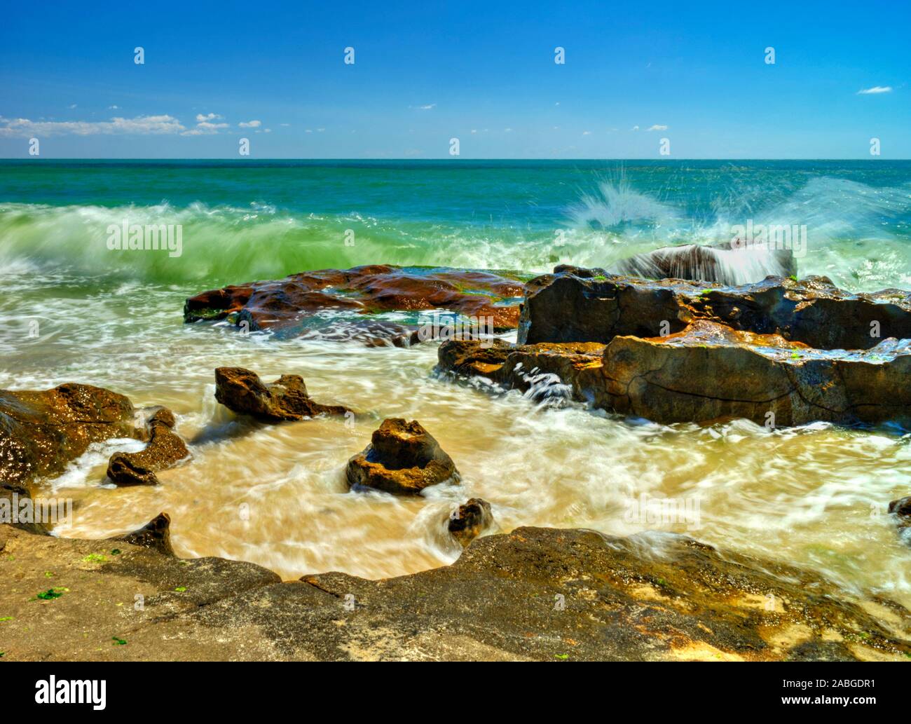 Beautiful landscape with rocks and sea waves on a sunny beach Stock ...