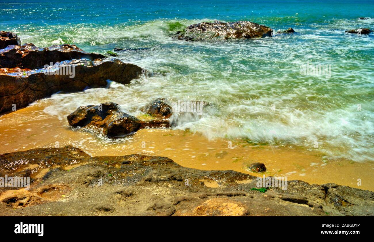 Beautiful landscape with rocks and sea waves on a sunny beach Stock ...