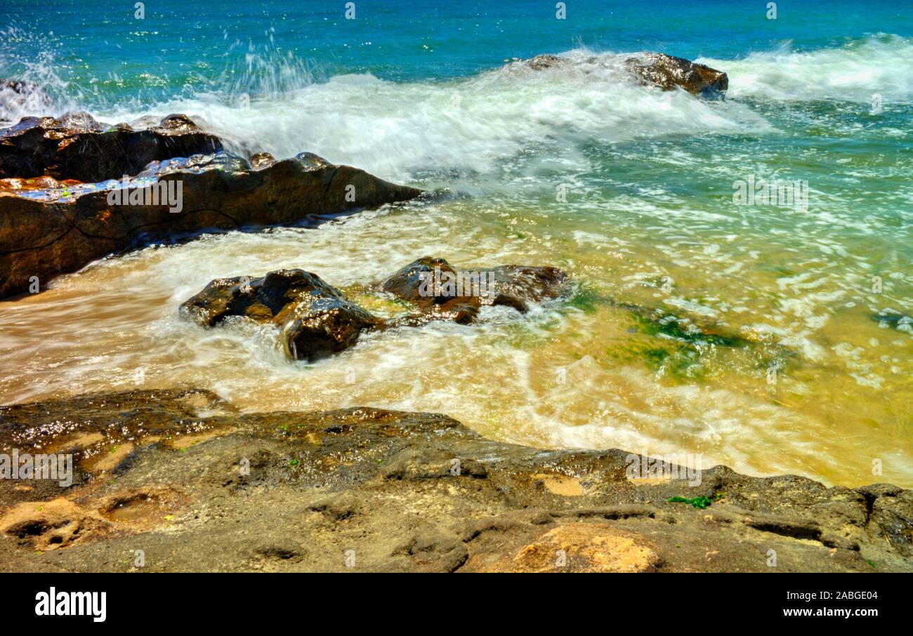 Beautiful landscape with rocks and sea waves on a sunny beach Stock ...