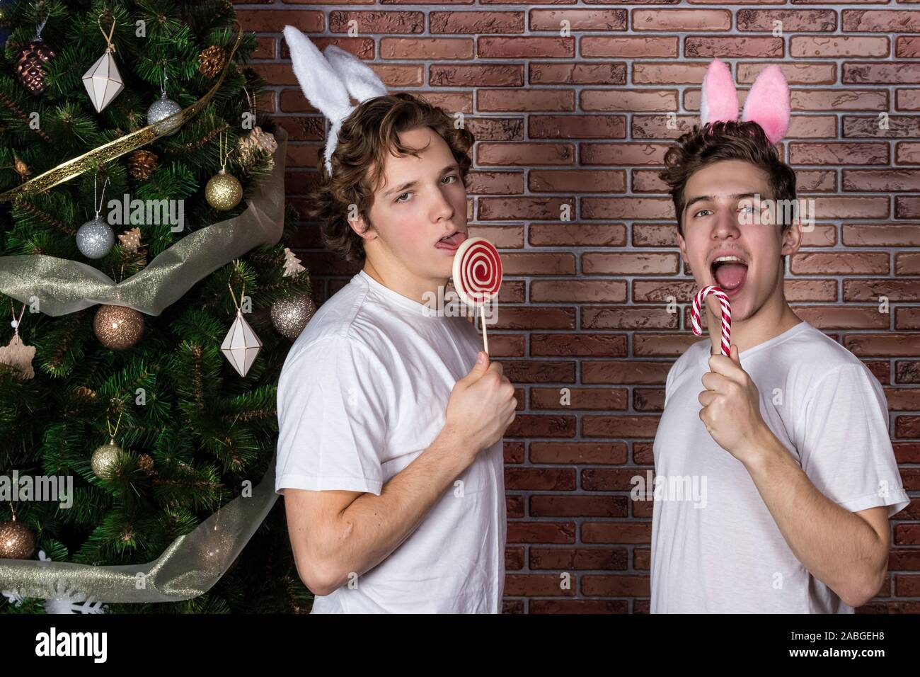Celebration. Two happy guys in suits rabbits Stock Photo - Alamy