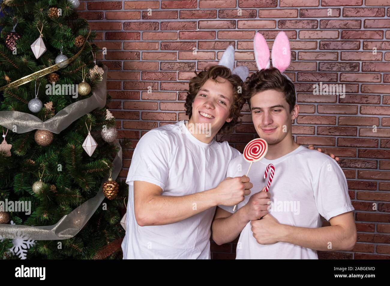 Celebration. Two happy guys in suits rabbits Stock Photo - Alamy