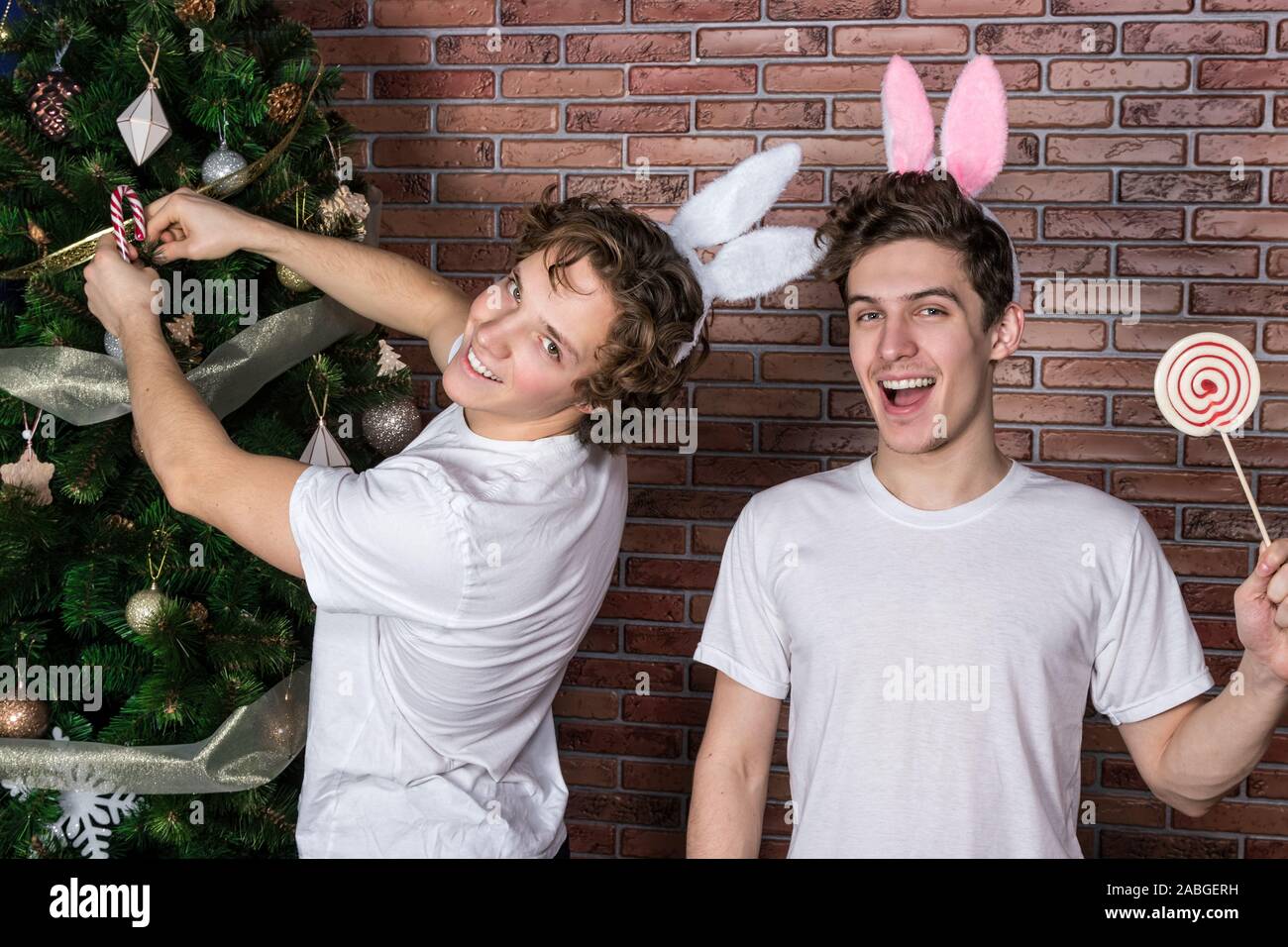 Celebration. Two happy guys in suits rabbits Stock Photo - Alamy