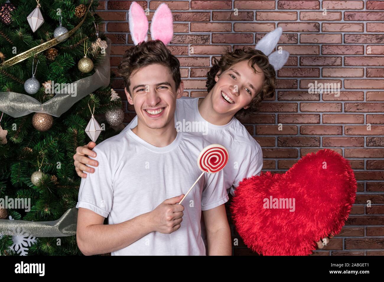 Celebration. Two happy guys in suits rabbits Stock Photo - Alamy
