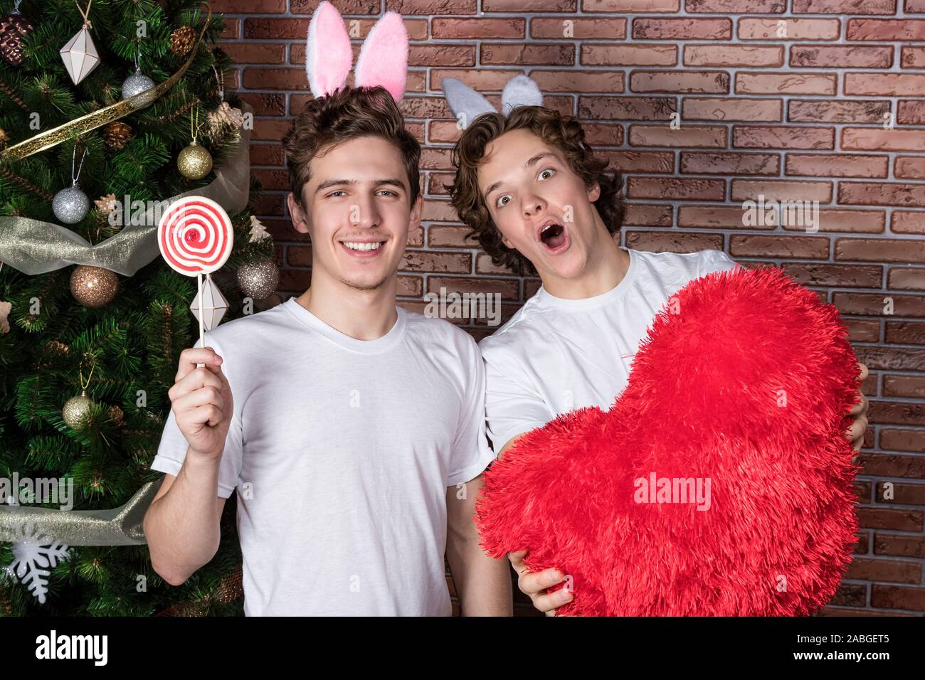 Celebration. Two happy guys in suits rabbits Stock Photo - Alamy