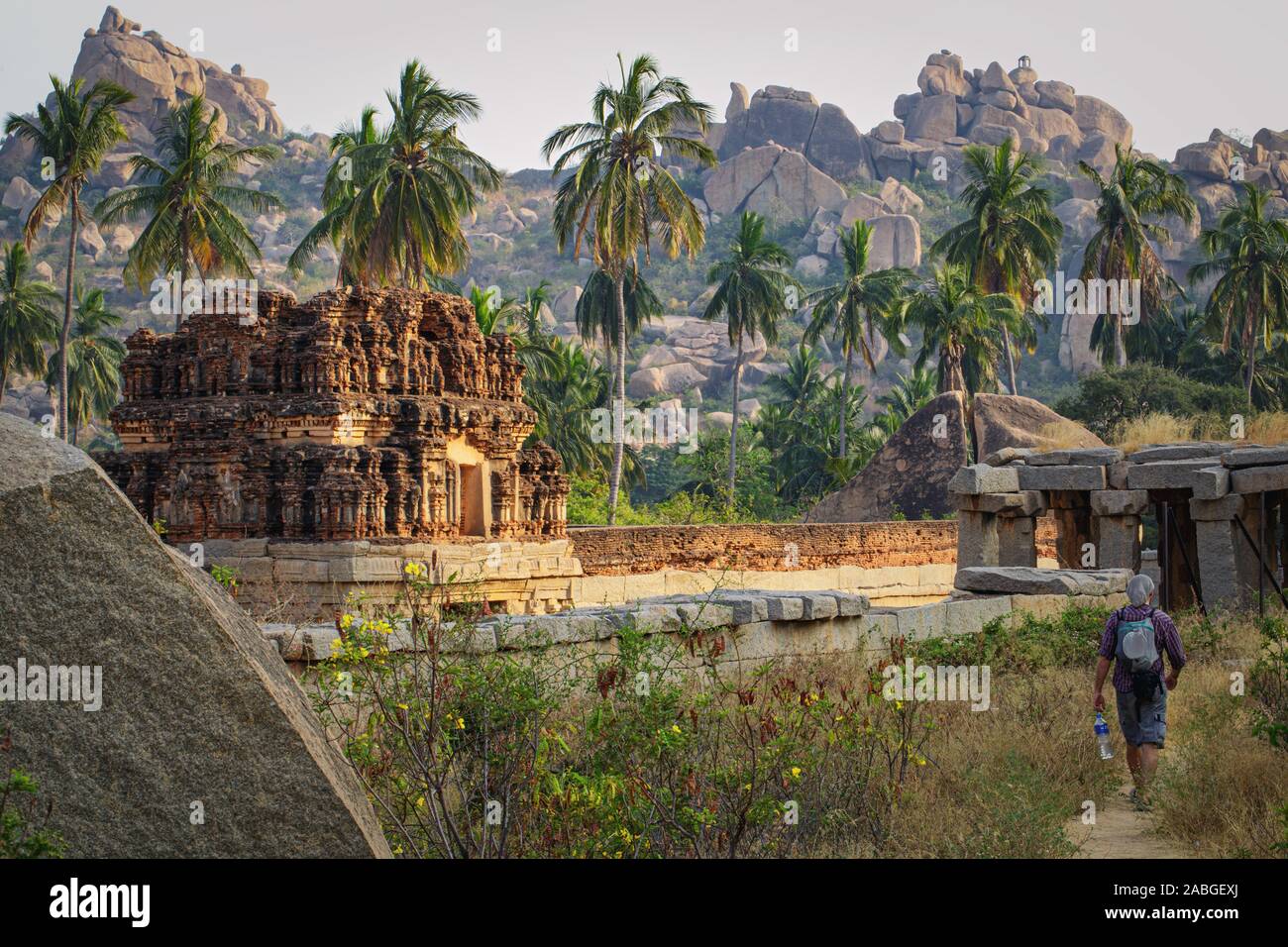 man visiting tourist attractions. Hampi, also referred to as the Group ...