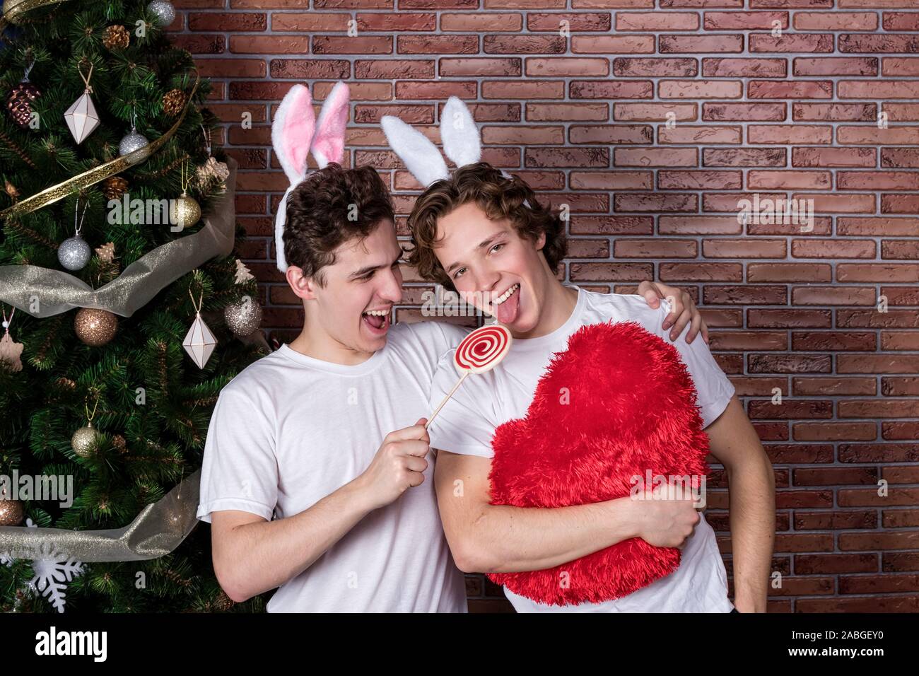 Celebration. Two happy guys in suits rabbits Stock Photo - Alamy