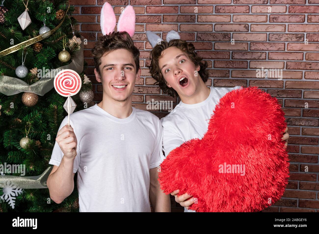 Celebration. Two happy guys in suits rabbits Stock Photo - Alamy