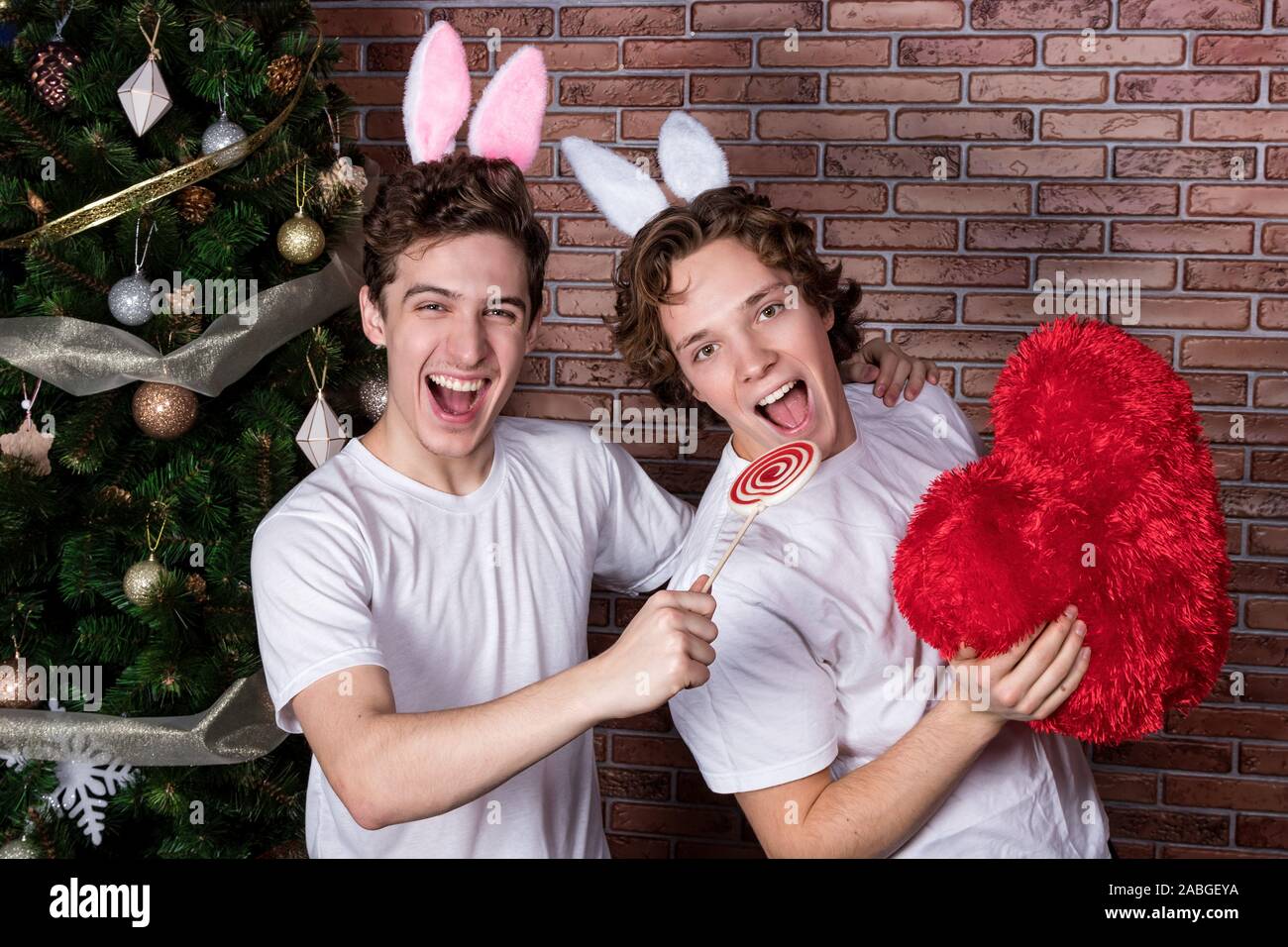 Celebration. Two happy guys in suits rabbits Stock Photo - Alamy