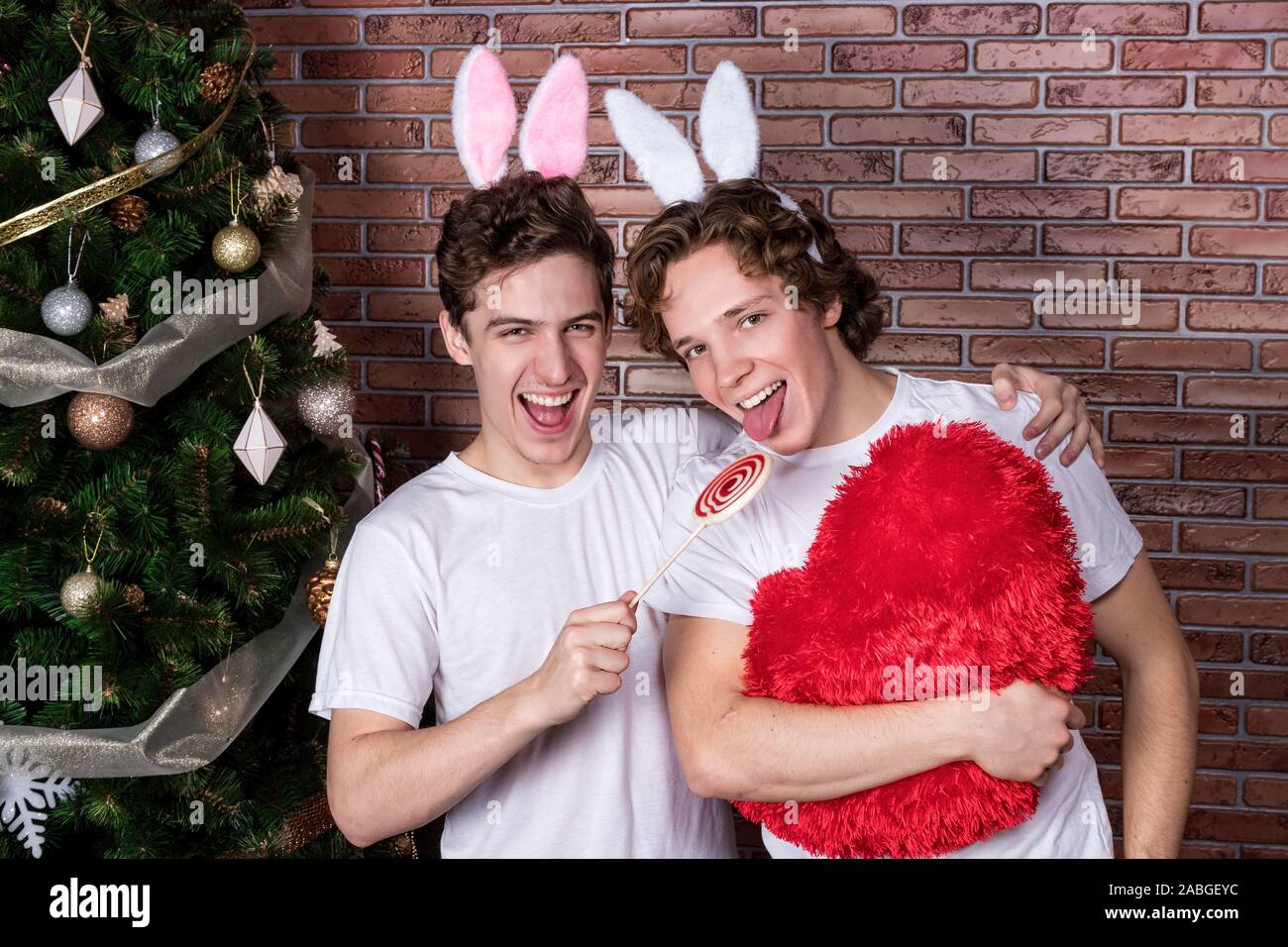 Celebration. Two happy guys in suits rabbits Stock Photo - Alamy