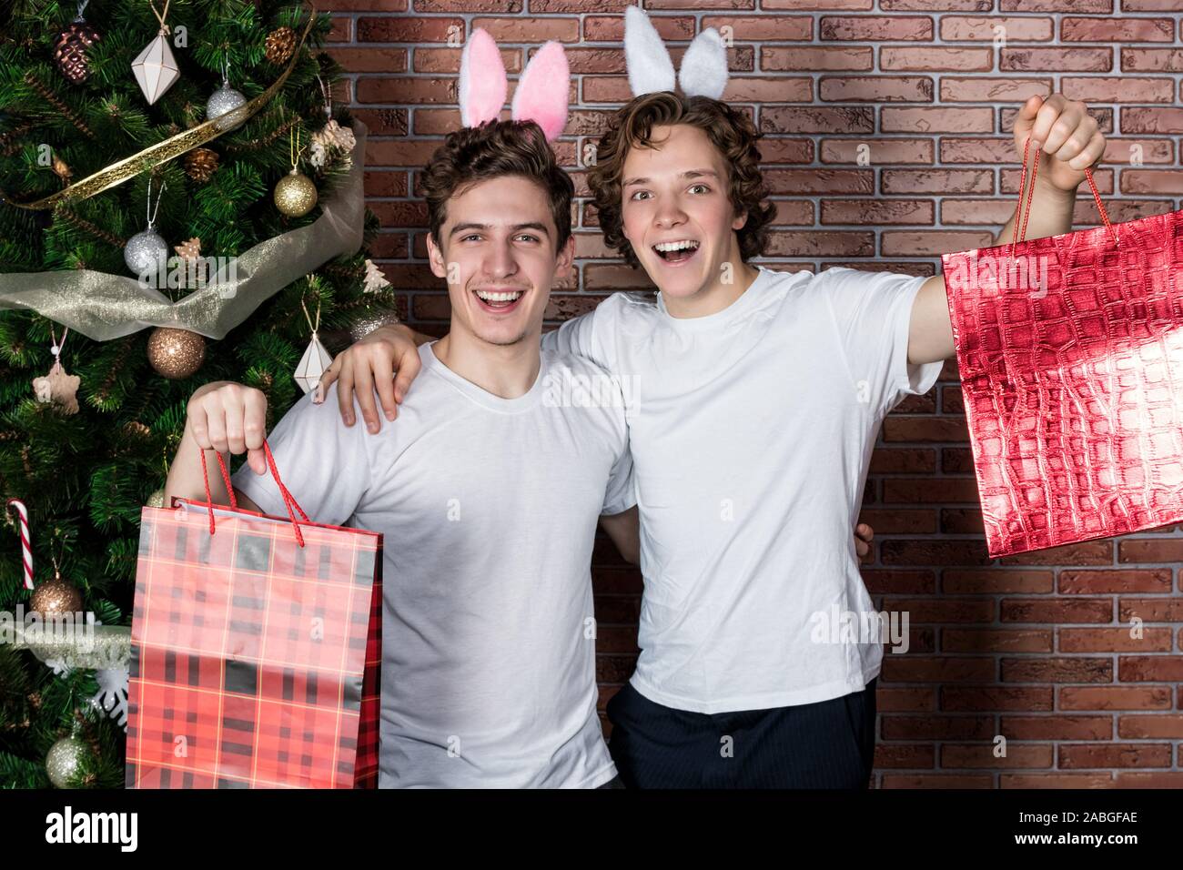 Celebration. Two happy guys in suits rabbits Stock Photo - Alamy