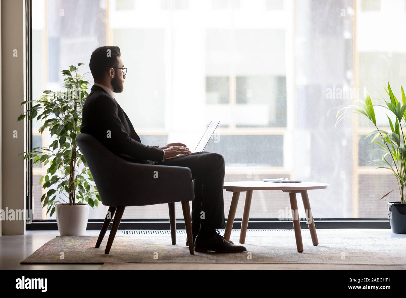 Successful businessman busy working typing on laptop Stock Photo - Alamy