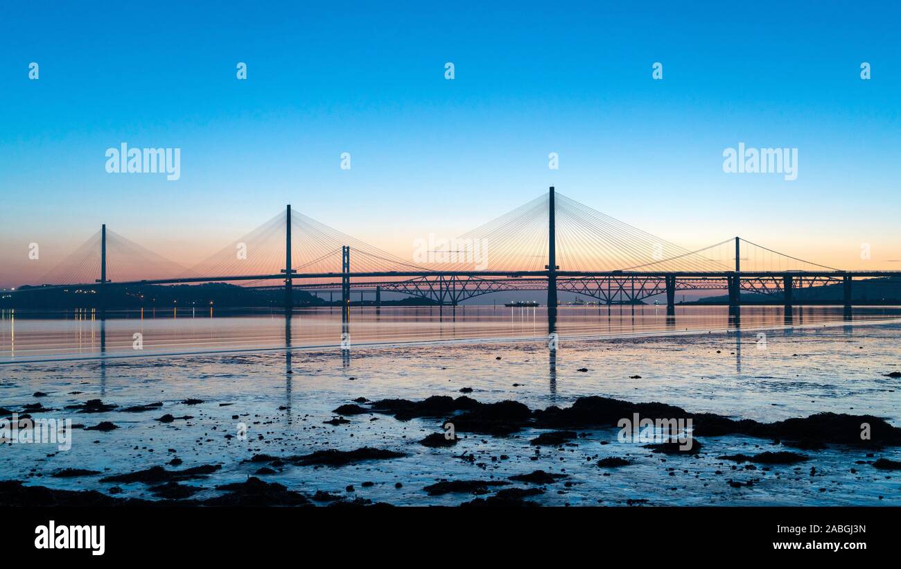 Sunrise view of the three major bridges crossing the Firth of Forth at ...