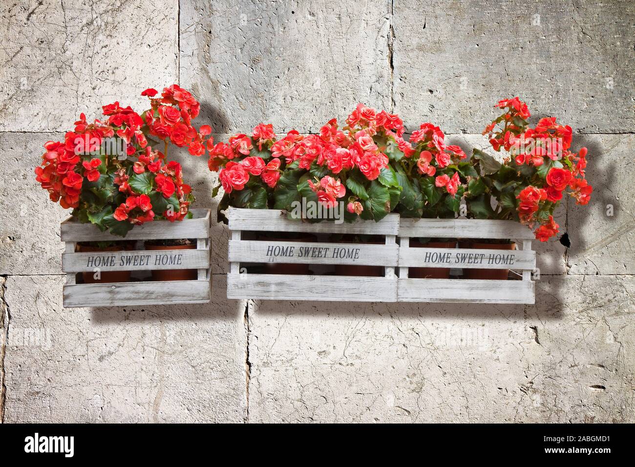 Wooden flowers boxes against an old brick wall - Home sweet home ...