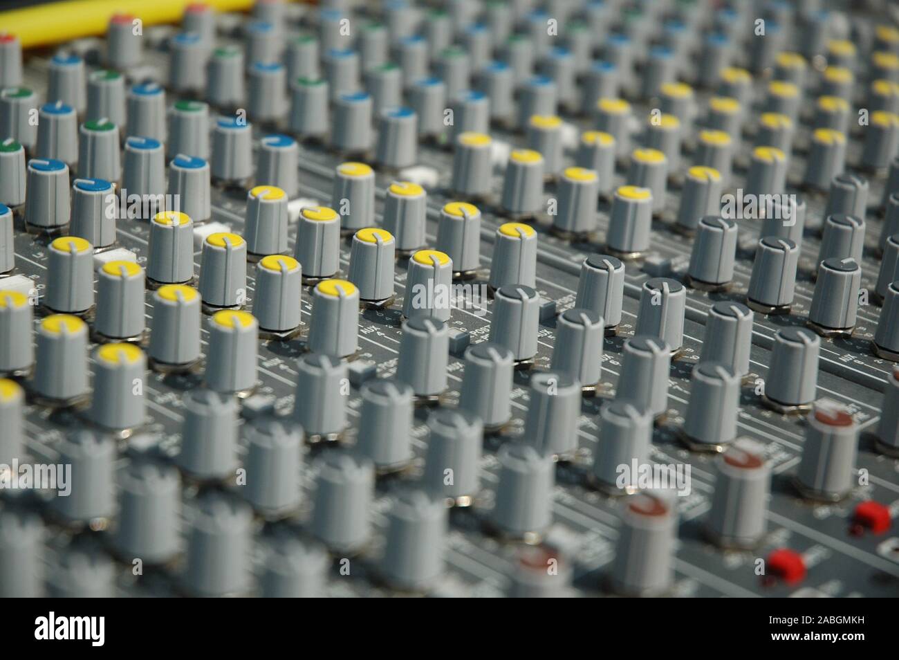 Audio mixing console in a recording studio. Faders and knobs of a sound ...
