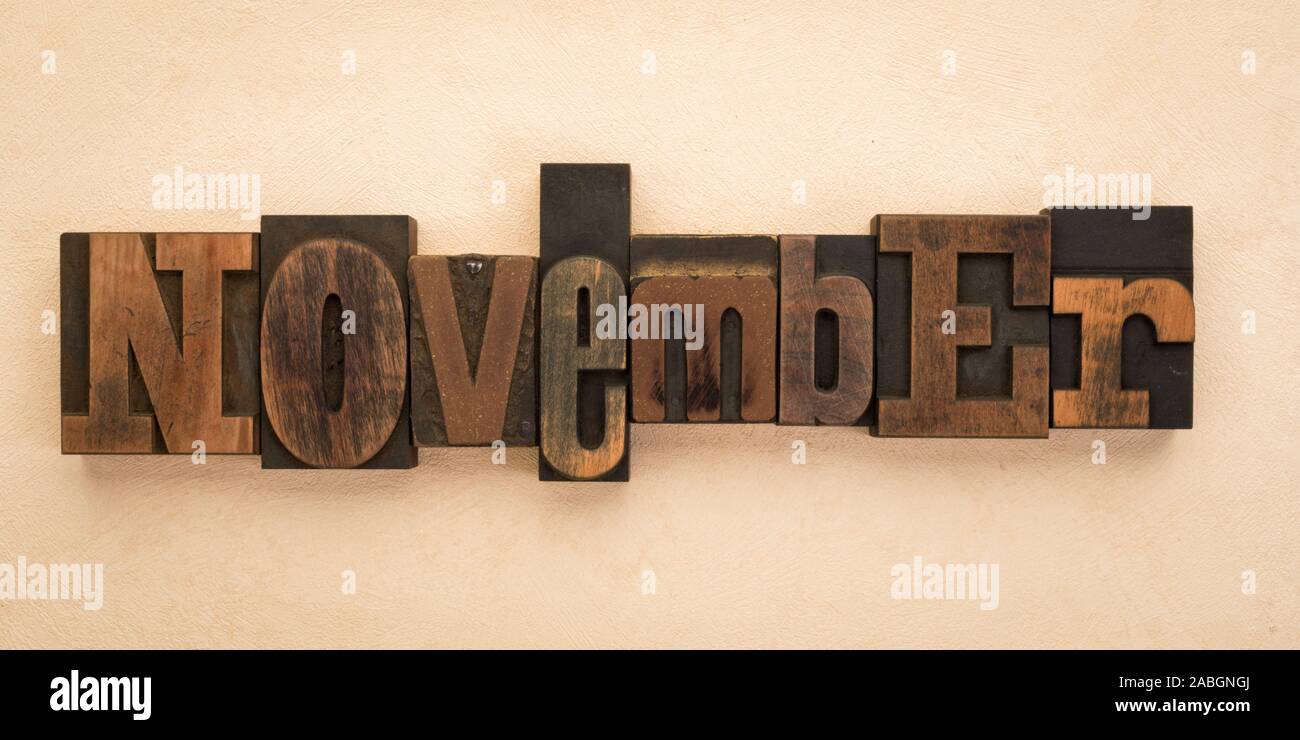 November, name of the month written with vintage letterpress printing ...