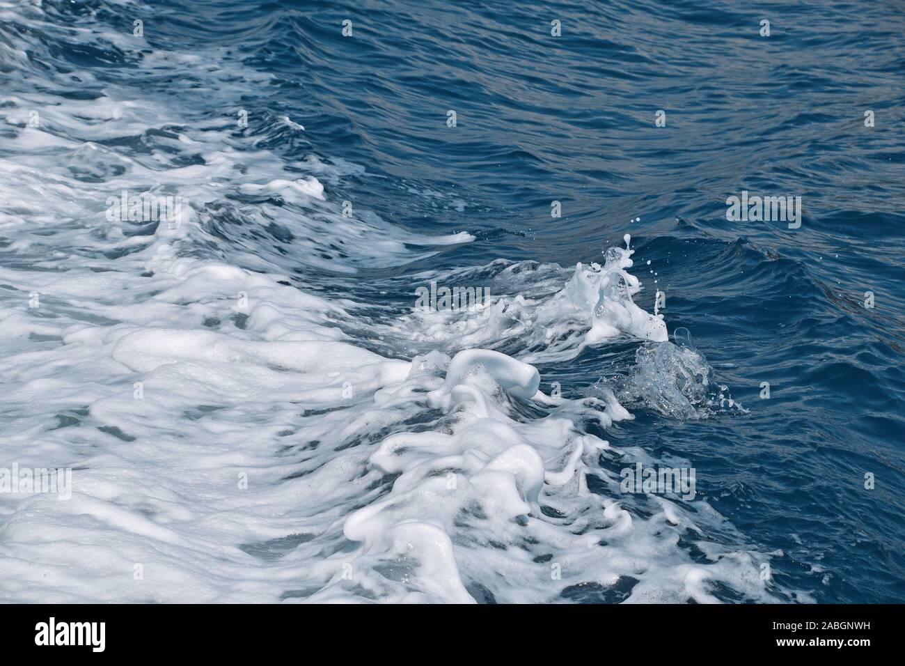 Turquoise blue sea water surface with ripples and waves, high angle ...