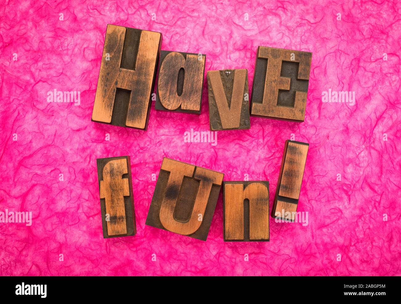 Have fun, phrase written with vintage letterpress printing blocks on ...