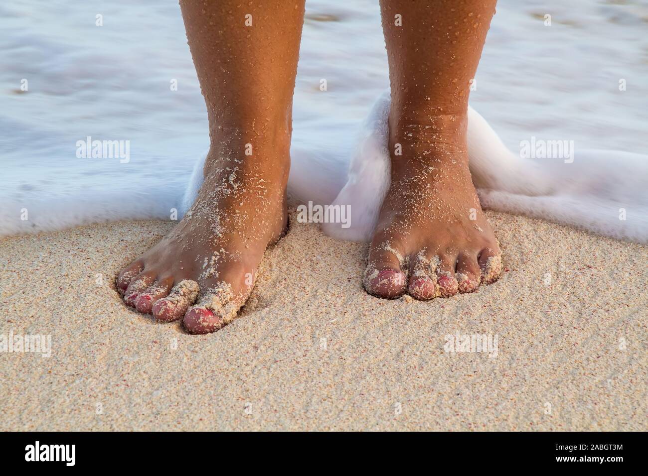 Feet in waves beach hi-res stock photography and images - Alamy
