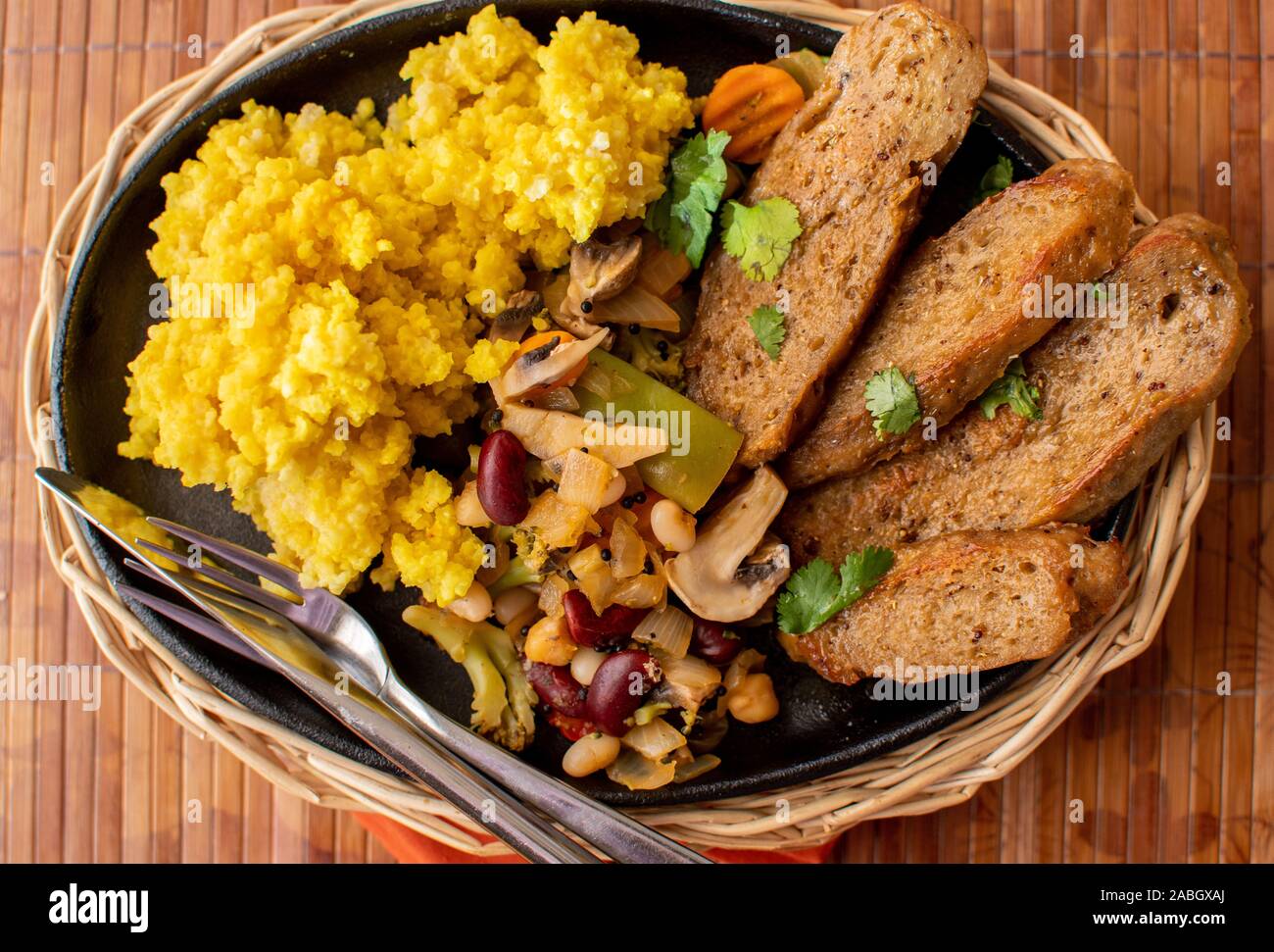 Millet and vegetables served with seitan slices Stock Photo - Alamy