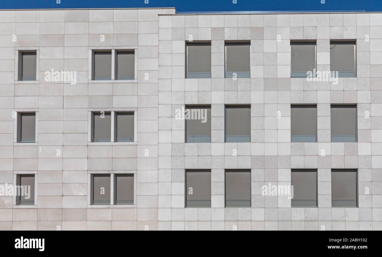 Grey Windows at Modern Marble Building Facade Stock Photo - Alamy