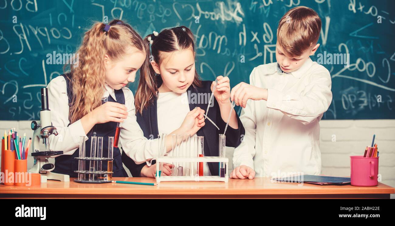 Teamwork concept. Test tubes with colorful liquid substances. Study of ...