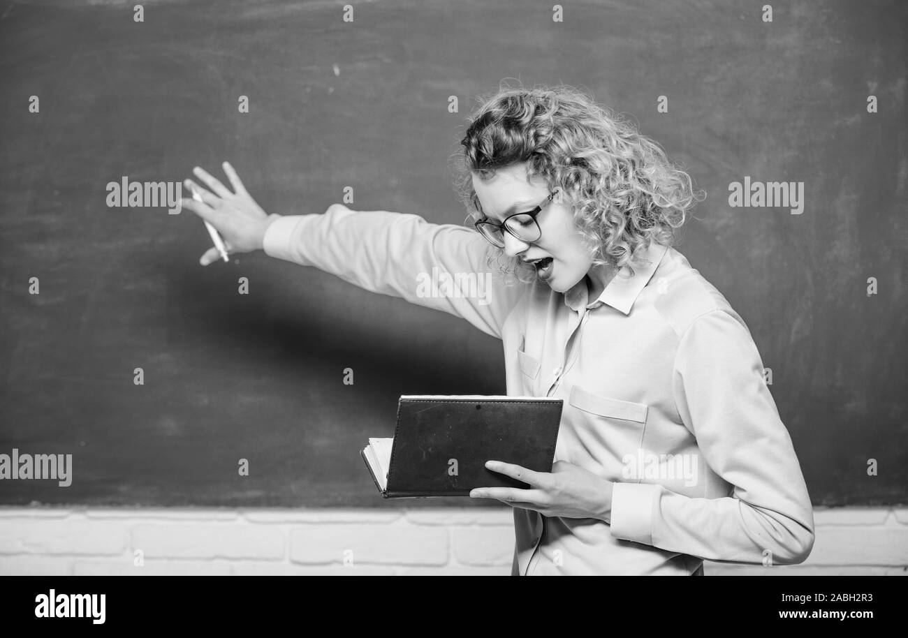 Pedagogue hold book and explaining information. Teacher explain hard ...