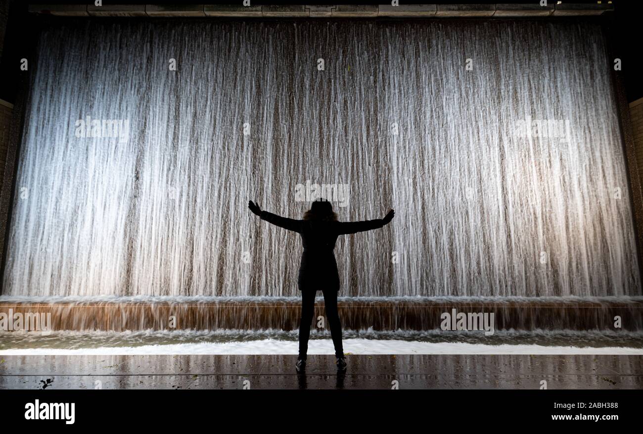 Woman silhouette in Paley park at night Stock Photo - Alamy