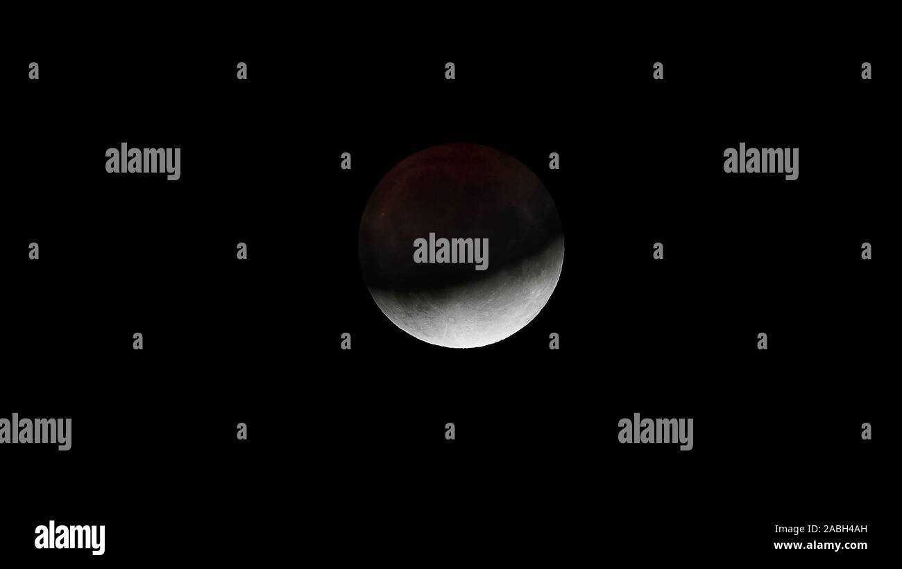 Partial lunar eclipse - slight red residual light visible on the ...