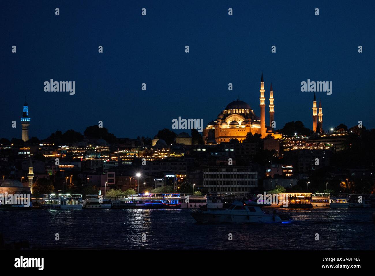 Istanbul, Turkey: night skyline with boats in the Golden Horn and ...