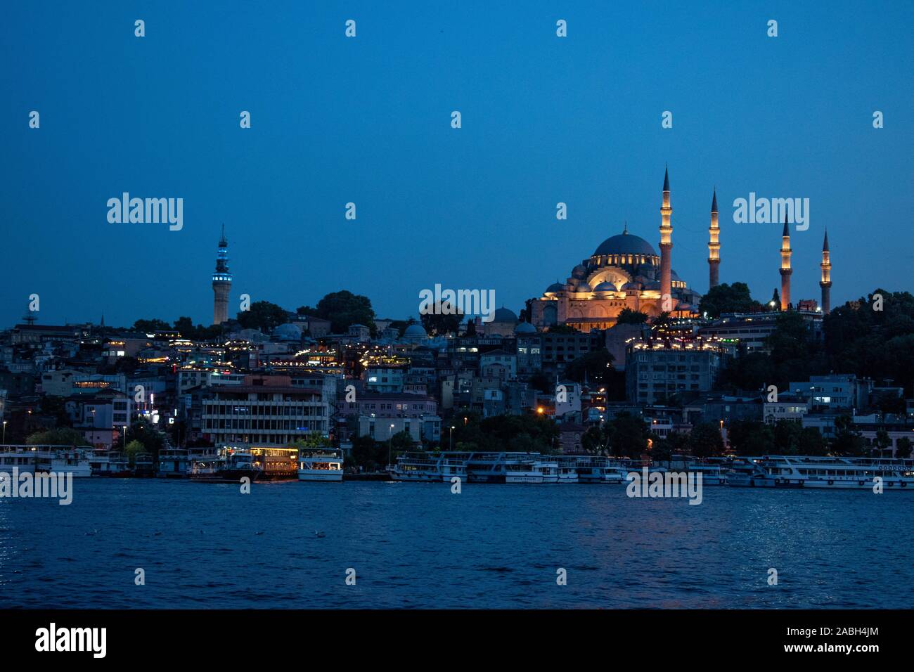 Istanbul, Turkey: night skyline with boats in the Golden Horn and ...