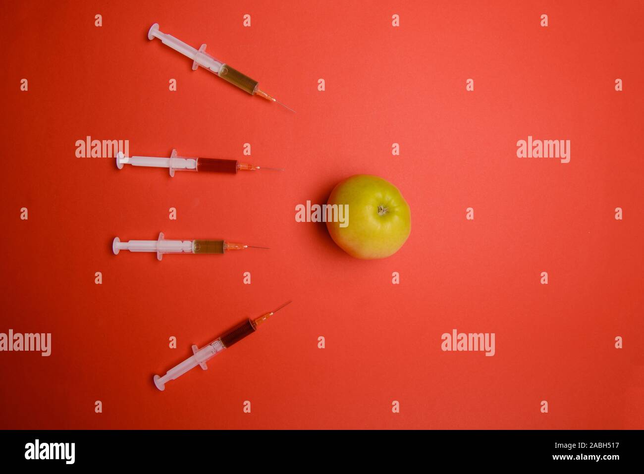 Chemical additives in food or genetically modified fruit concept. Green ...